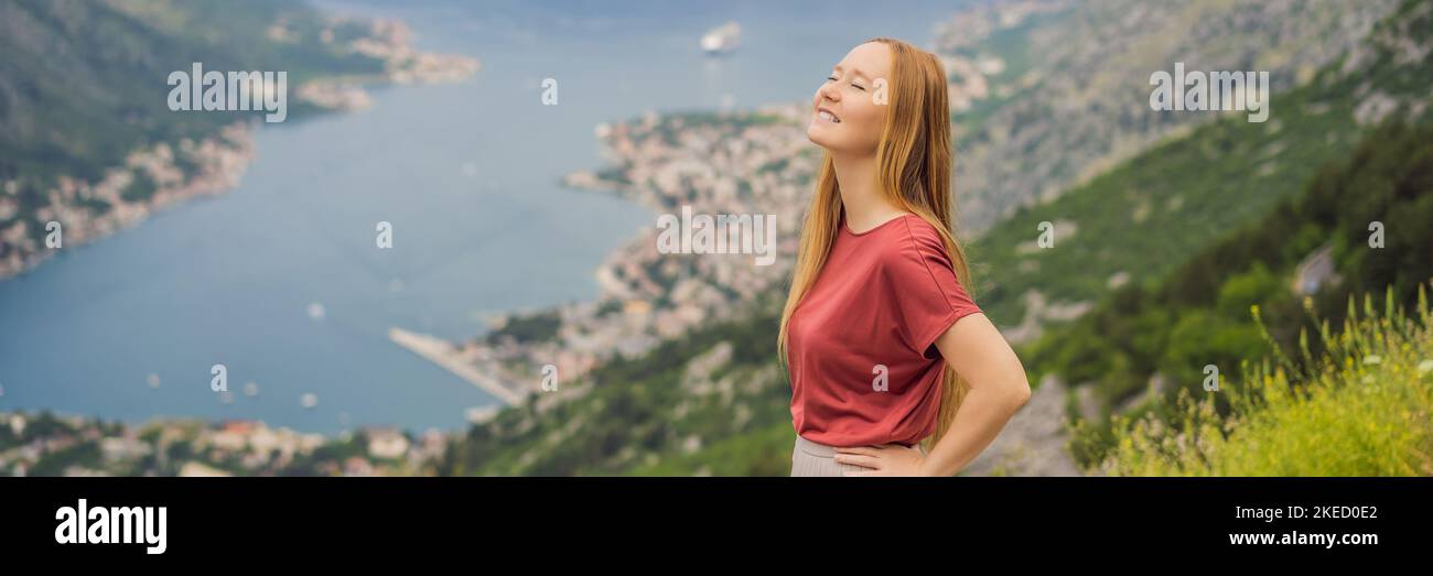 BANNER, LONG FORMAT Woman tourist enjoys the view of Kotor. Montenegro ...