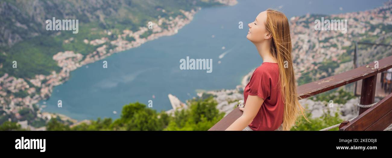 BANNER, LONG FORMAT Woman tourist enjoys the view of Kotor. Montenegro ...