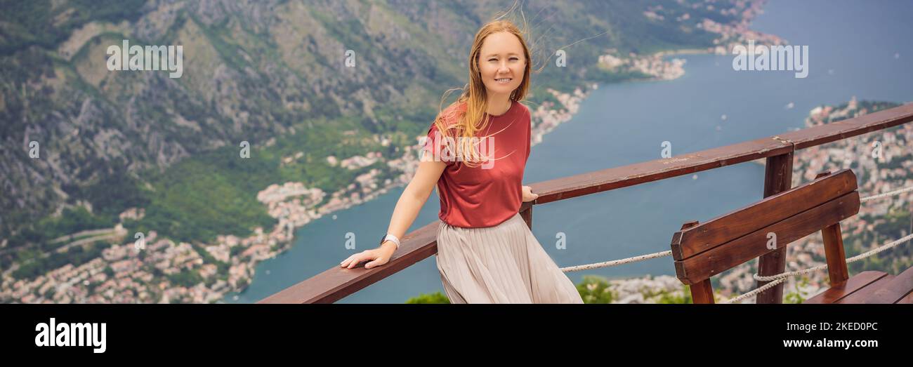 BANNER, LONG FORMAT Woman tourist enjoys the view of Kotor. Montenegro ...
