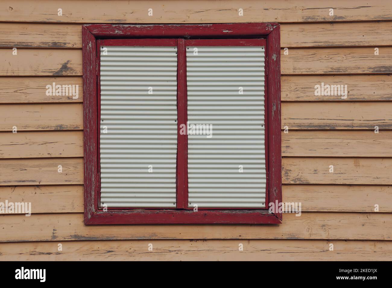 the exterior of a shuttered window on old weatherboard wall Stock Photo ...