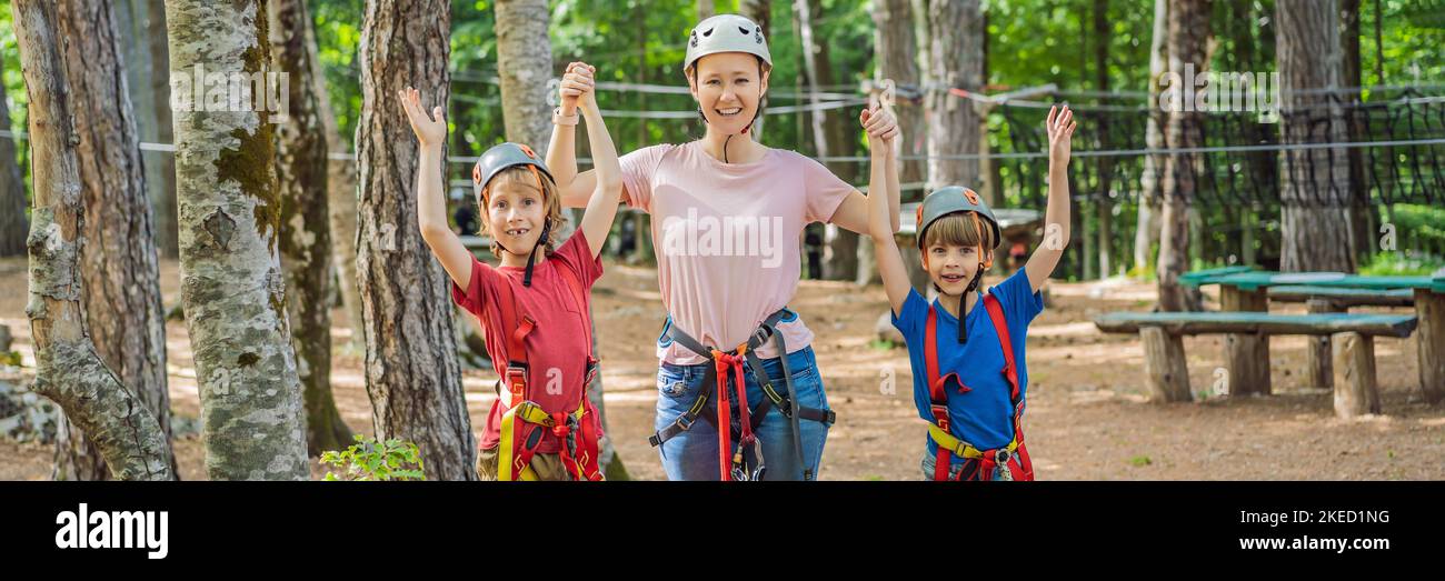 BANNER, LONG FORMAT Friends on the ropes course. Young people in safety ...