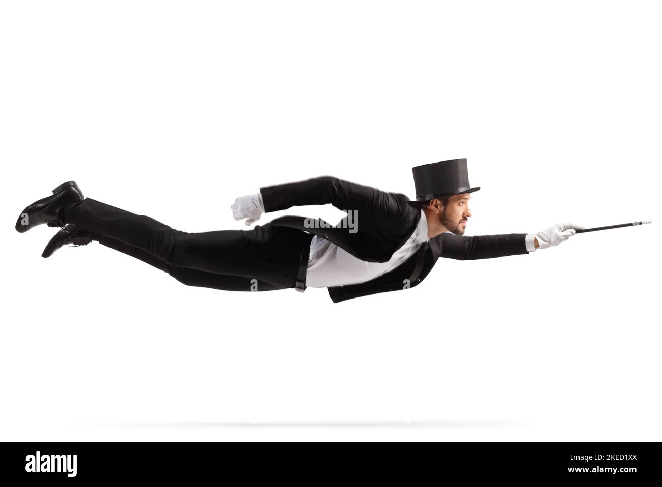Full length shot of a magician flying and holding a magic wand isolated ...