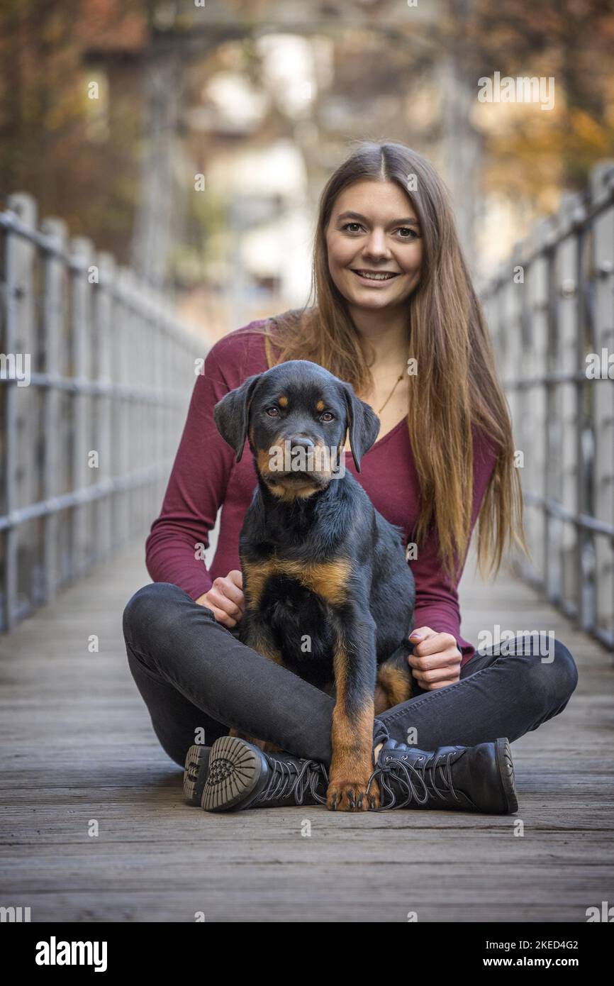 woman with Rottweiler Puppy Stock Photo - Alamy