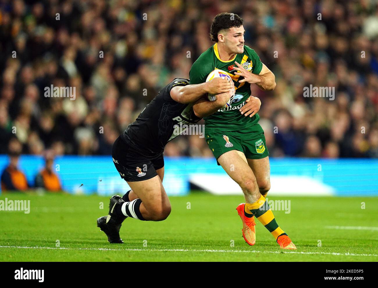 Australia's Nathan Cleary (right) is tackled by New Zealand's Isaiah ...