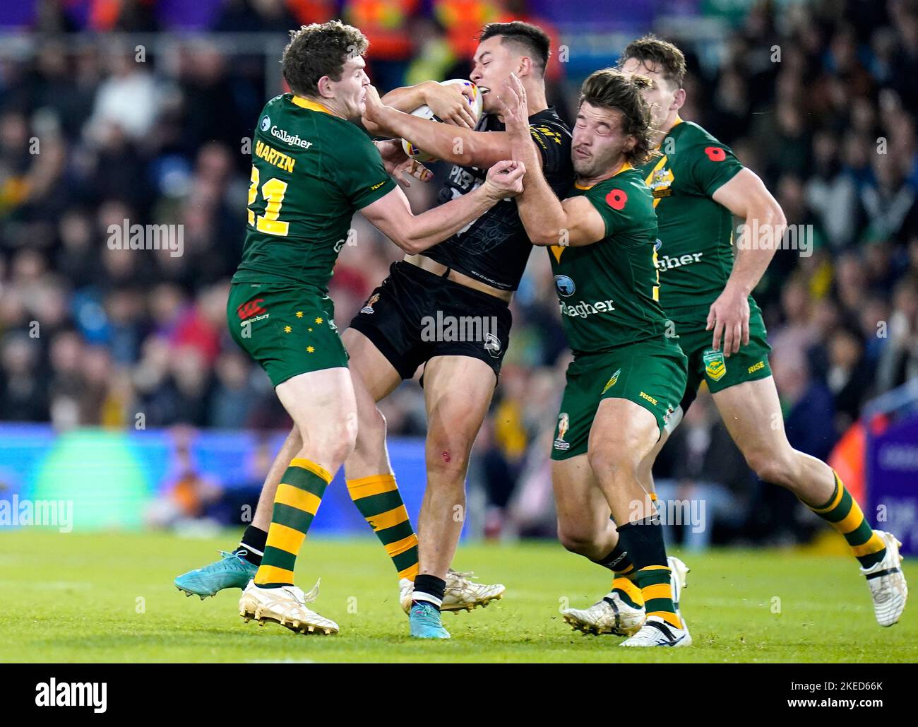 New Zealand's Joseph Manu (centre) is tackled by Australia's Liam ...