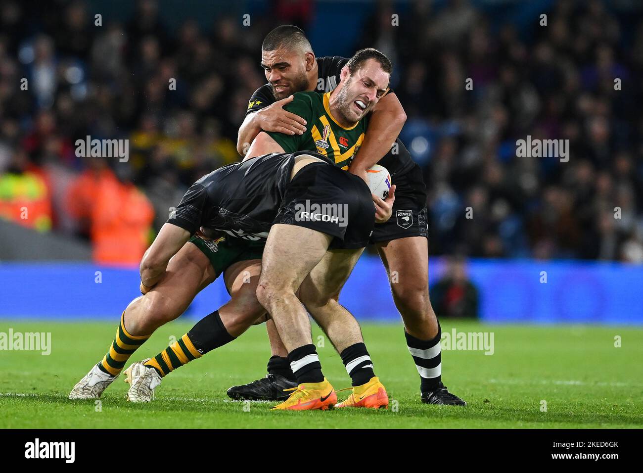 Isaah Yeo of Australia is tackled by Brandon Smith and Isaiah Papali'i ...