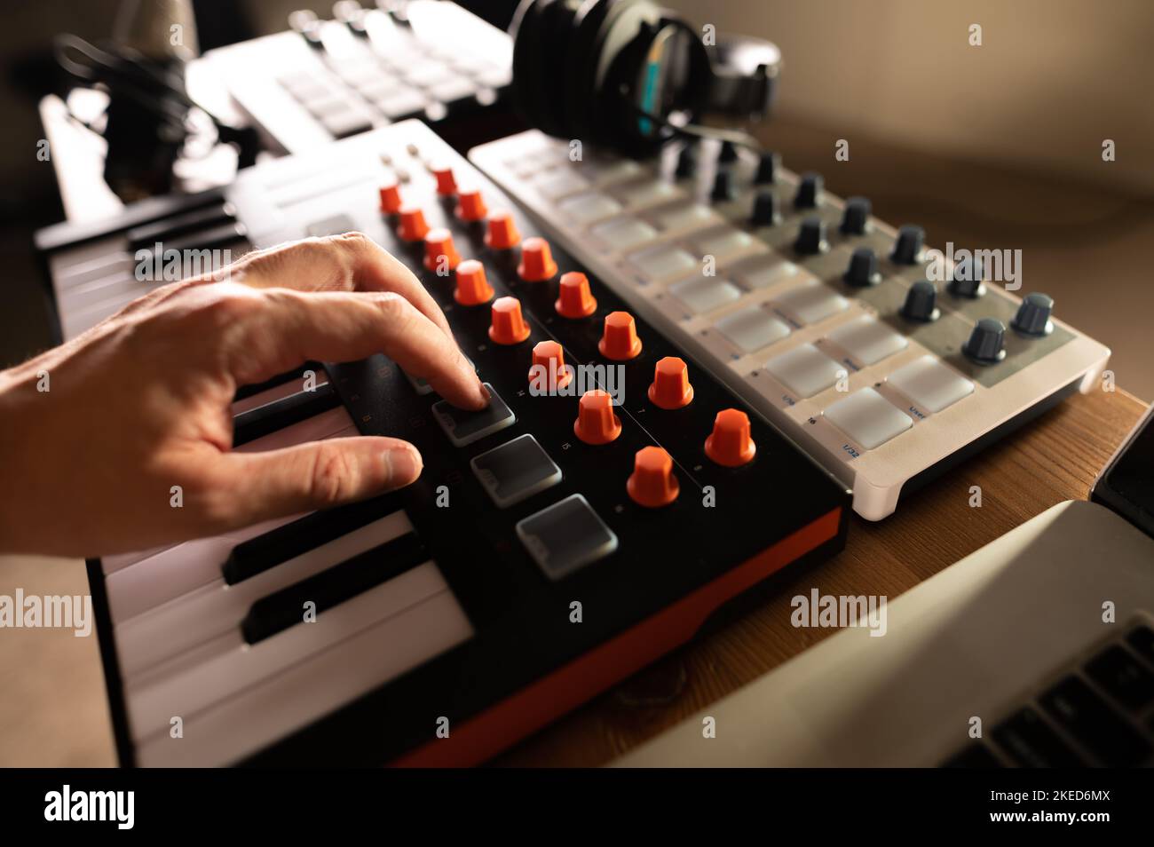 Recording studio, music studio. Musician's hand on the keys of a midi ...