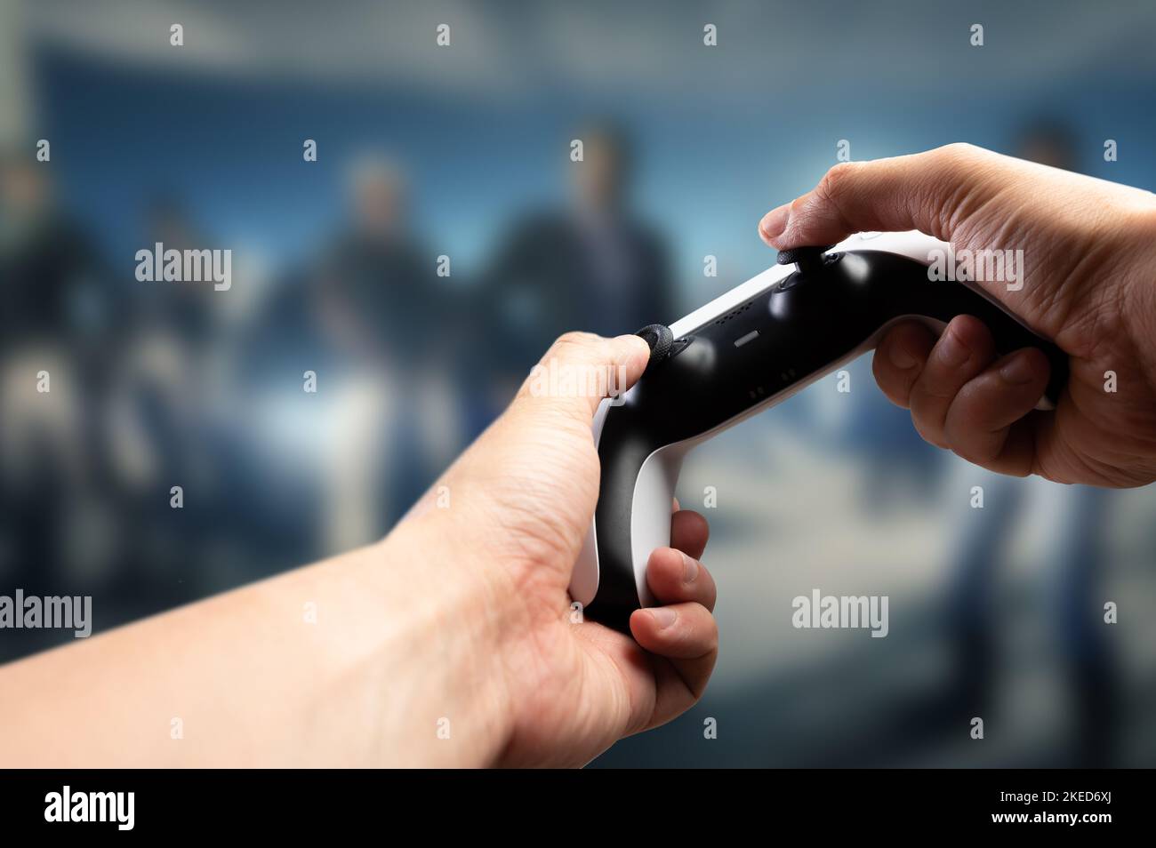 Entertaining video games. A gamer holds a GAM22ICB joystick in his ...