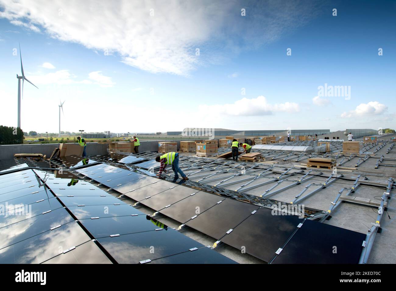 Placing solar panels on the roof of a company. Ede Netherlands ...