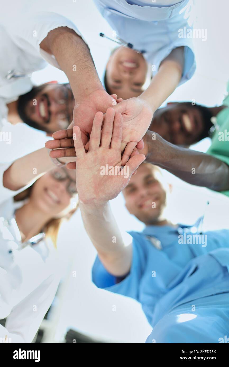 Professional Doctors Holding Each Other Hands. Multinational Medician ...