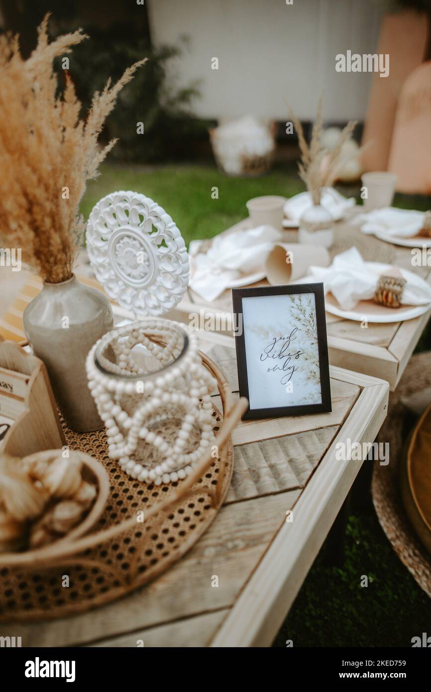 A vertical shot of a Boho styled party table design Stock Photo - Alamy