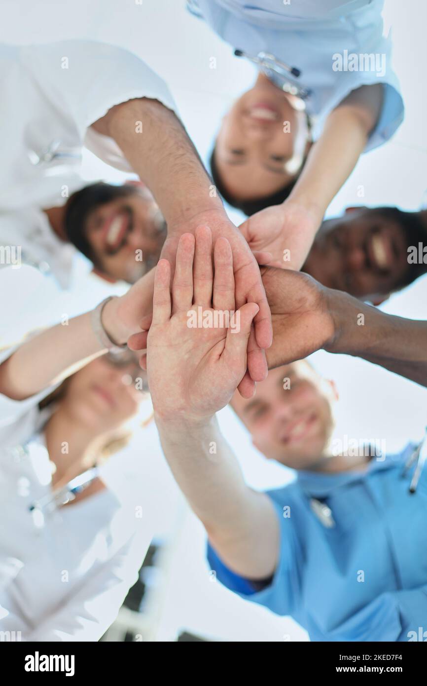 Professional Doctors Holding Each Other Hands. Multinational Medician ...
