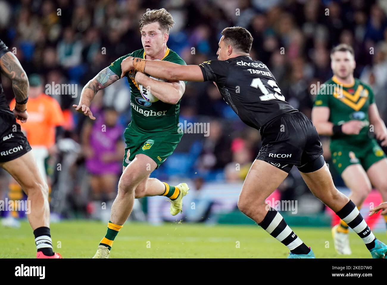 Australia's Cameron Munster attempts to get past New Zealand's Joseph ...
