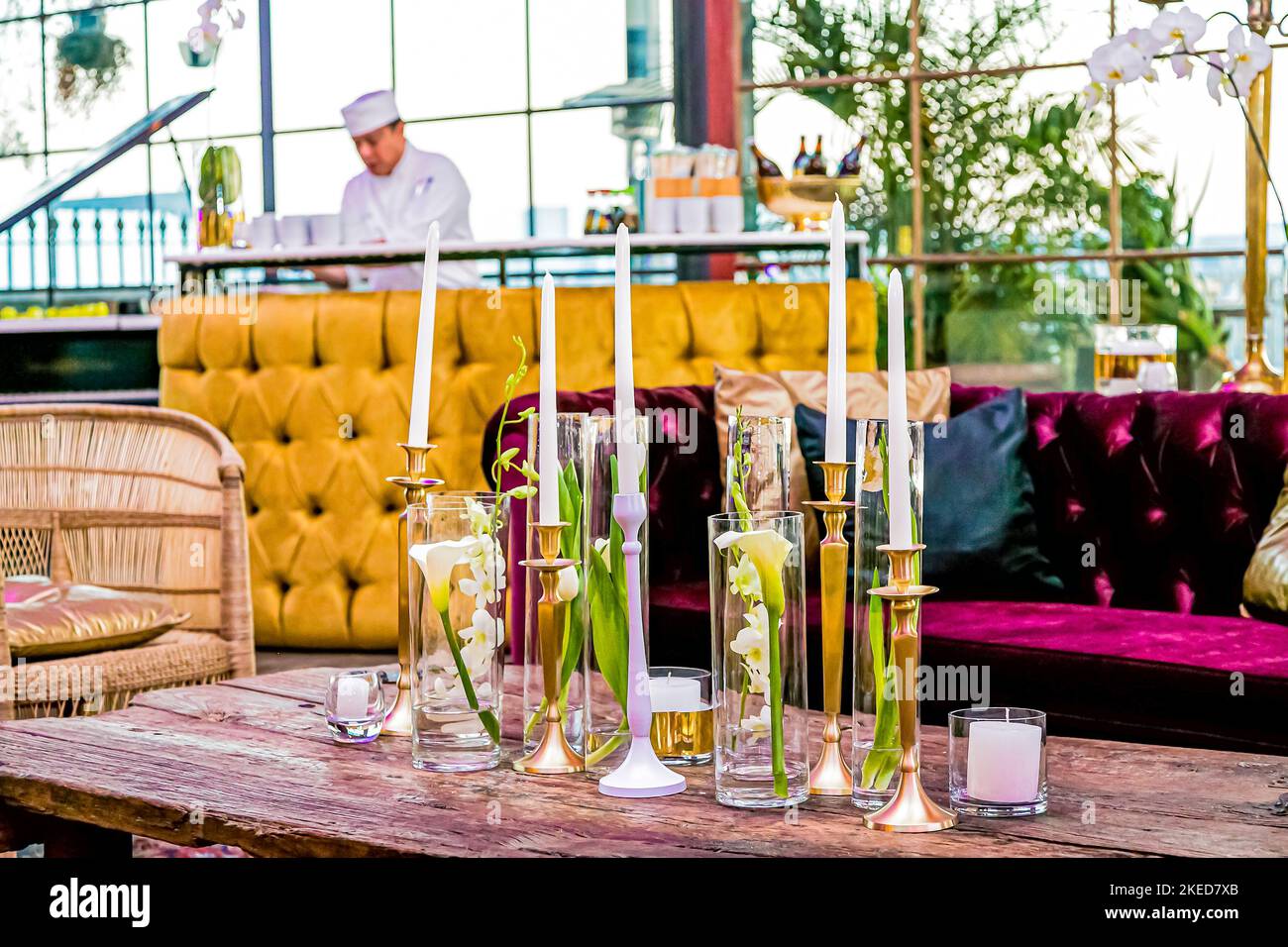 The beautiful decorated interior of a party venue with candle holders ...