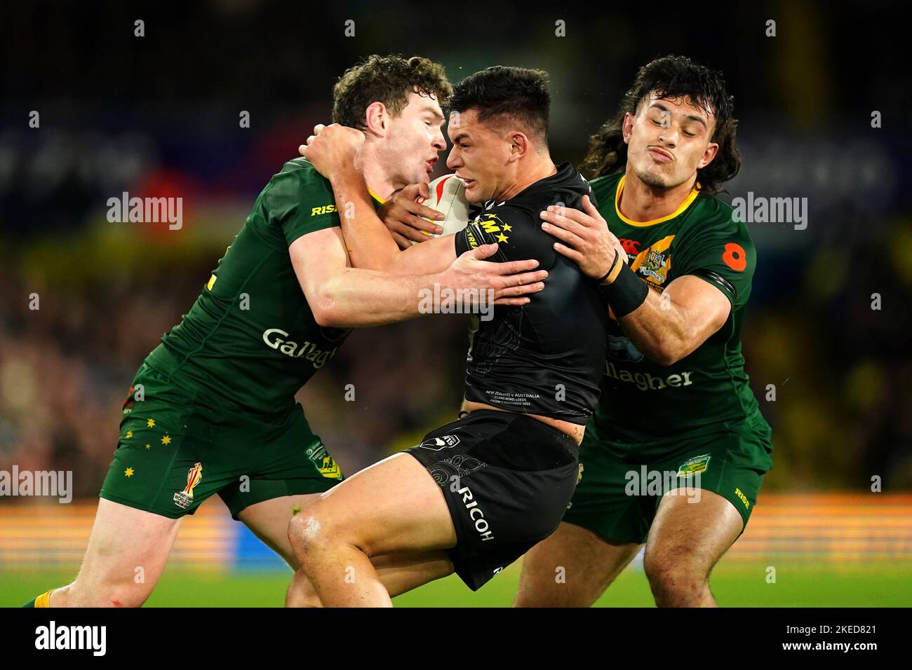 New Zealand's Joseph Manu (centre) is tackled by Australia's Tino Fa ...