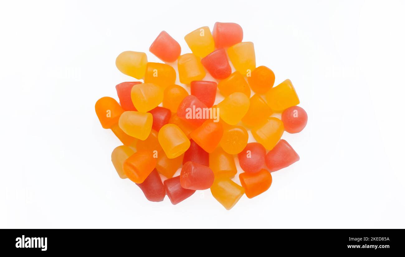 Selective focus, close-up texture of orange and yellow multivitamin ...
