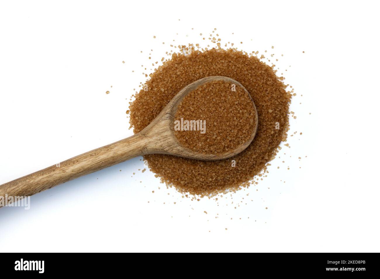 large spoon with brown sugar on white background, unrefined natural ...