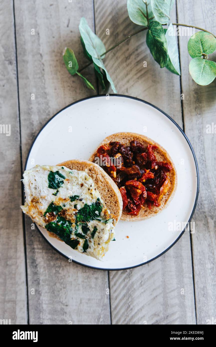 A closeup shot of Sun Dried Tomato and Egg Breakfast Sandwich Stock ...