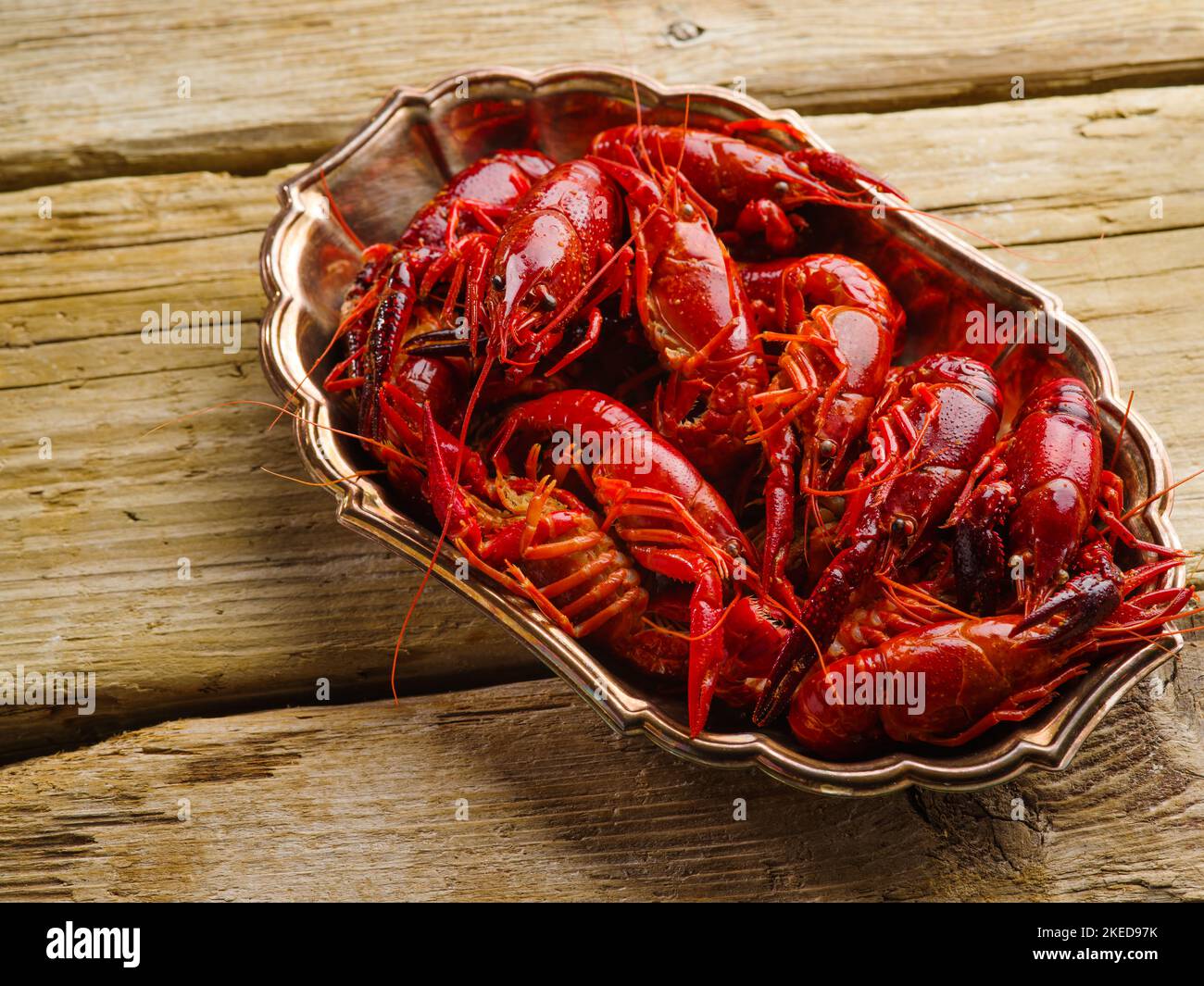 Stylish culinary composition. Dish with appetizing boiled crayfish on a ...