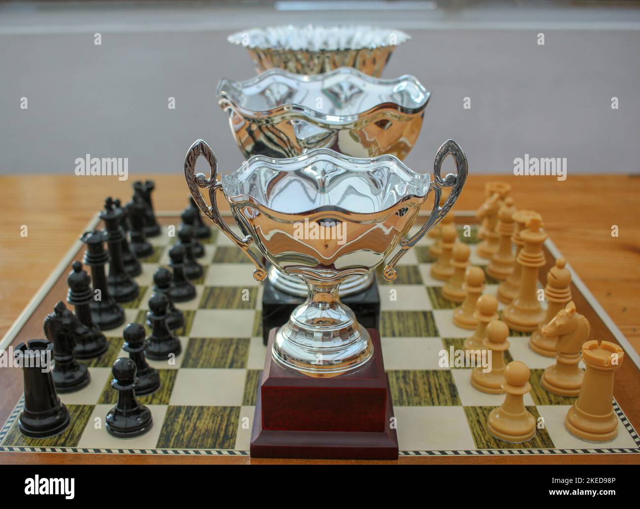 some trophies on a chessboard as a symbol of the benefits of choosing a ...