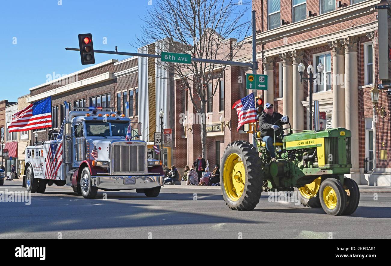 EMPORIA, KANSAS - NOVEMBER 11, 2022 John Deere tractor leads a very ...
