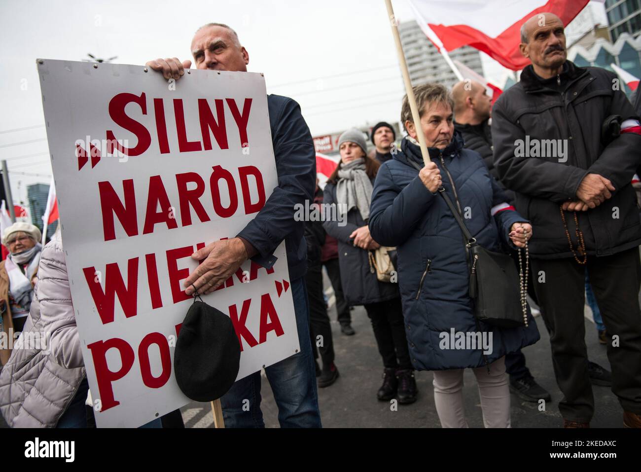 A participant is holding a placard that says "Strong Nation, Great ...