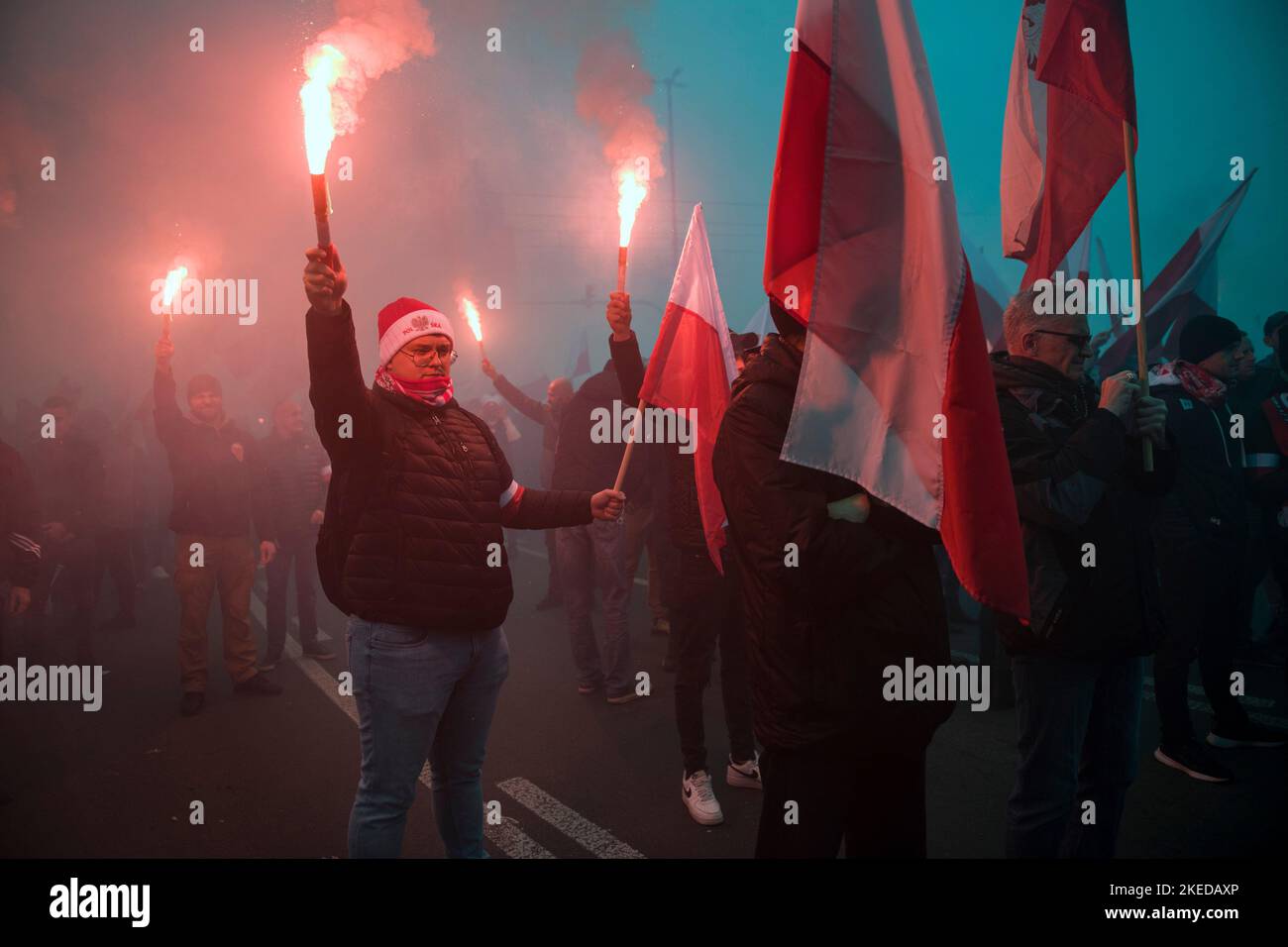Polish nationalists are burning flares and wave Polish flags during the ...