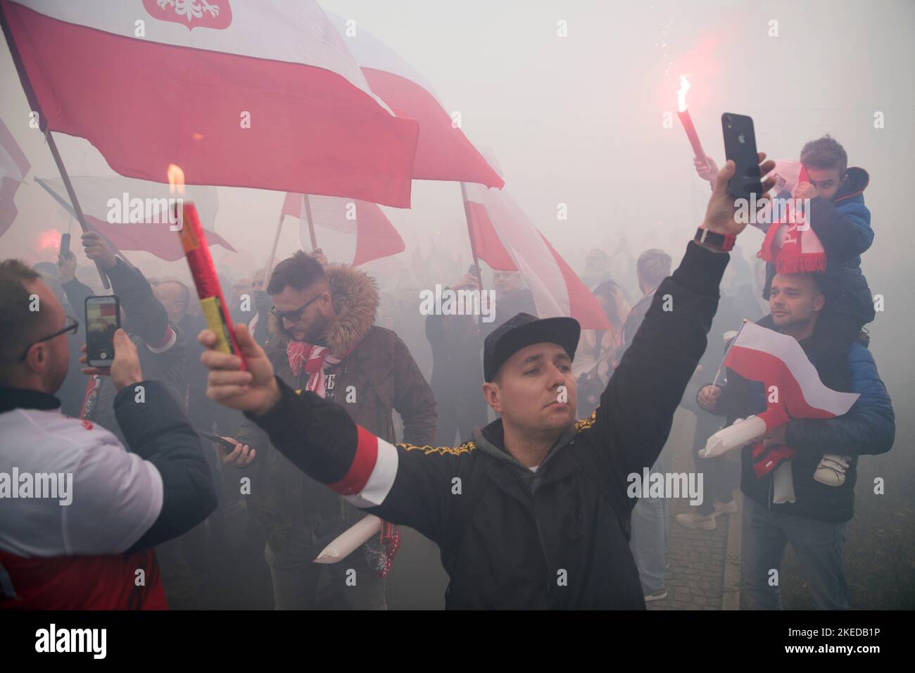 Participants are burning flares and wave Polish flags during the ...