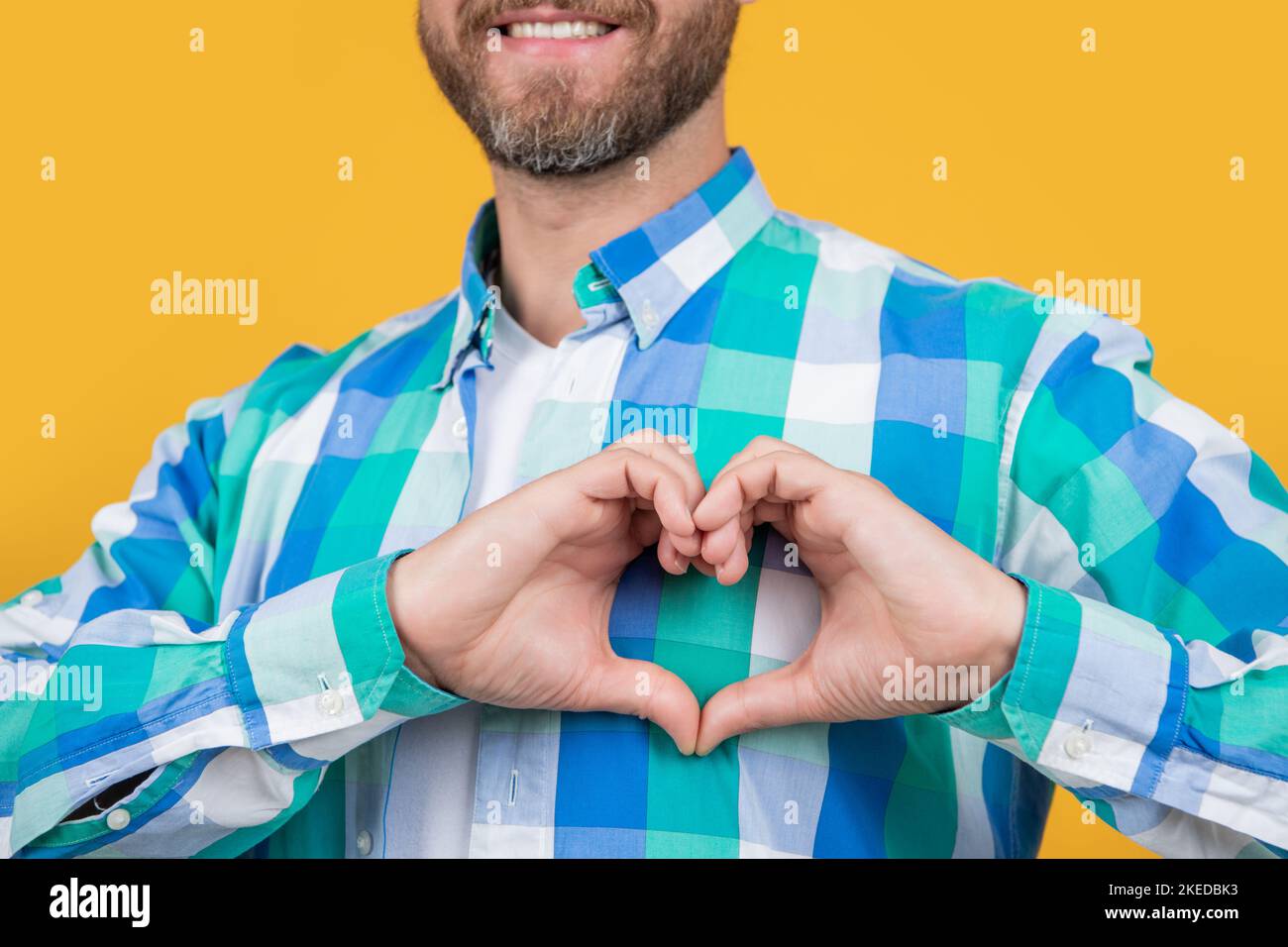cropped bearded caucasian man in shirt show love heart isolated on ...