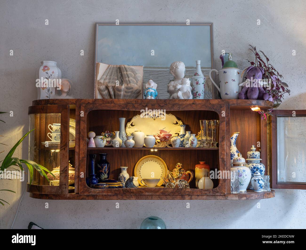 Stylish vintage interior. Shelf on wall. Decorative porcelain Stock ...