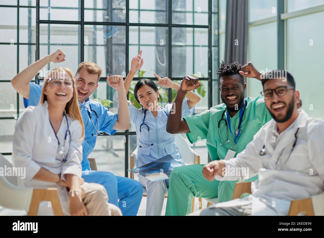 happy team of diverse doctors in hospital lobby Stock Photo - Alamy