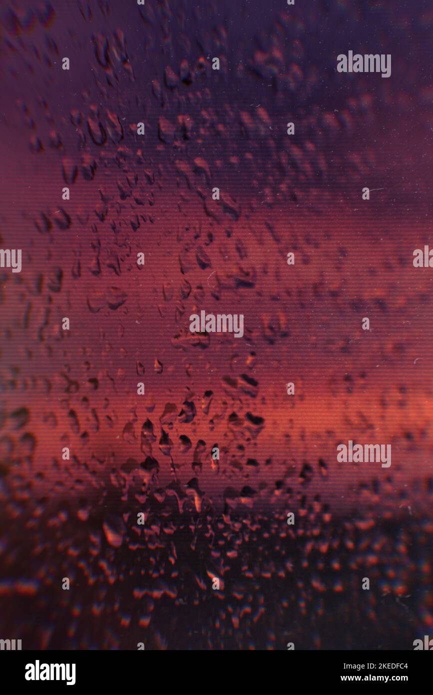 A vertical shot of raindrops on a window Stock Photo - Alamy