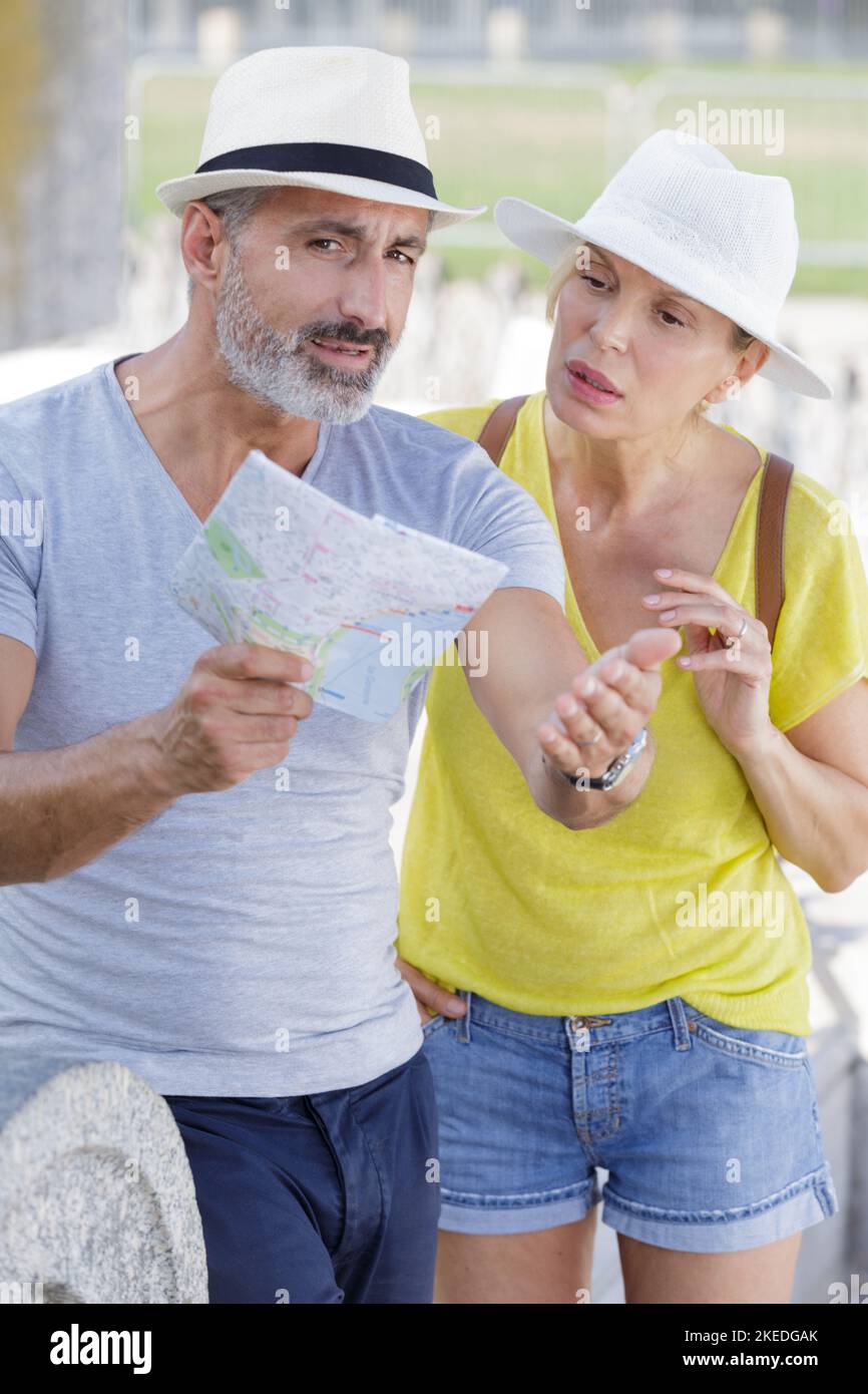 people looking at a map Stock Photo - Alamy