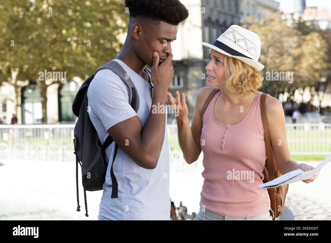 backpacker couple arguing over a city map Stock Photo - Alamy