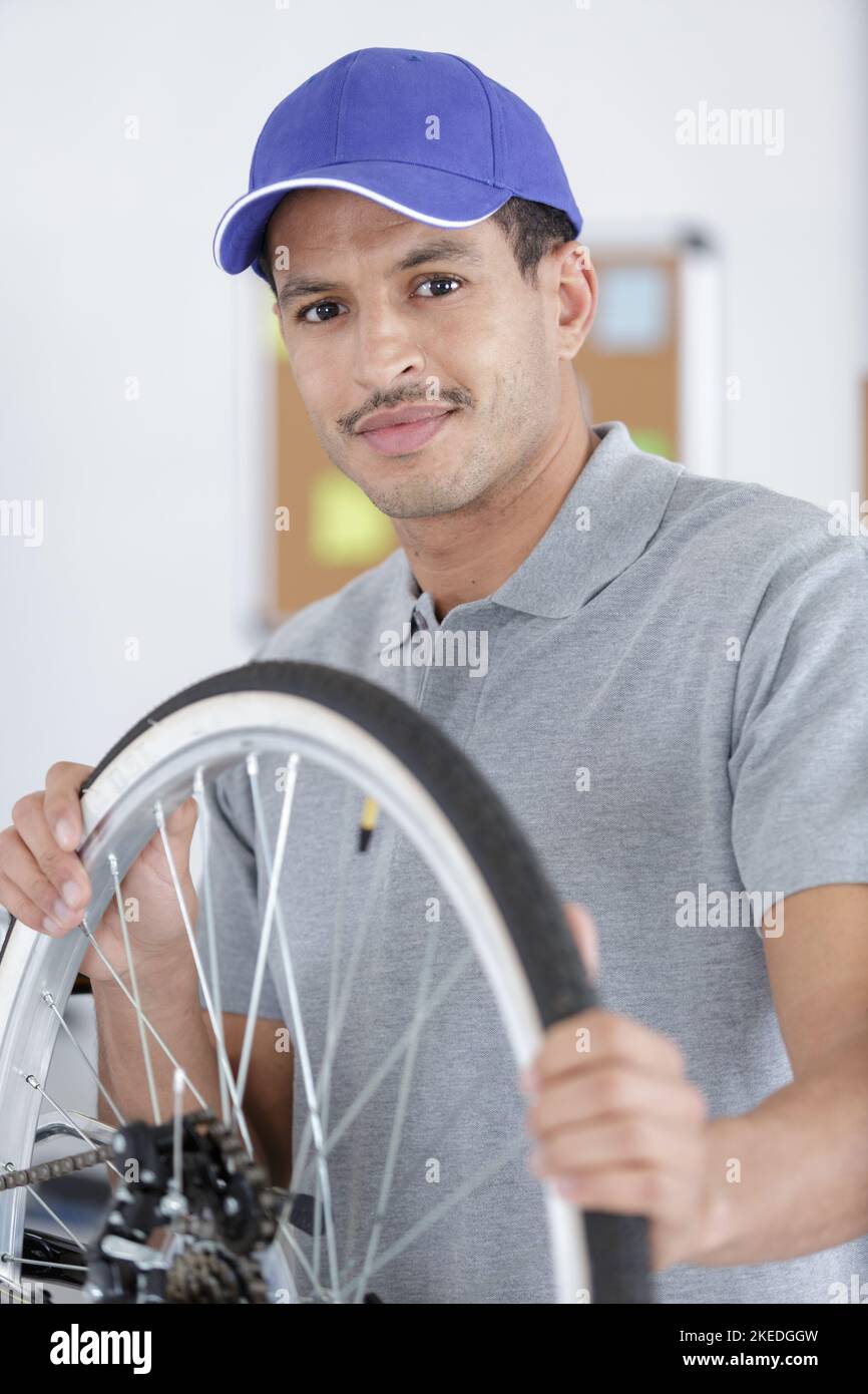 man working in bike workshop Stock Photo - Alamy