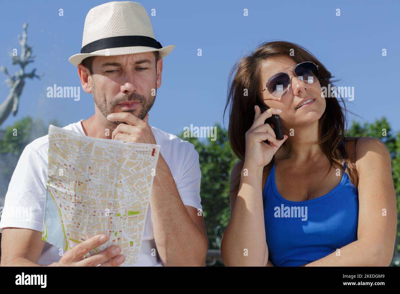 confused couple of tourists searching location Stock Photo - Alamy