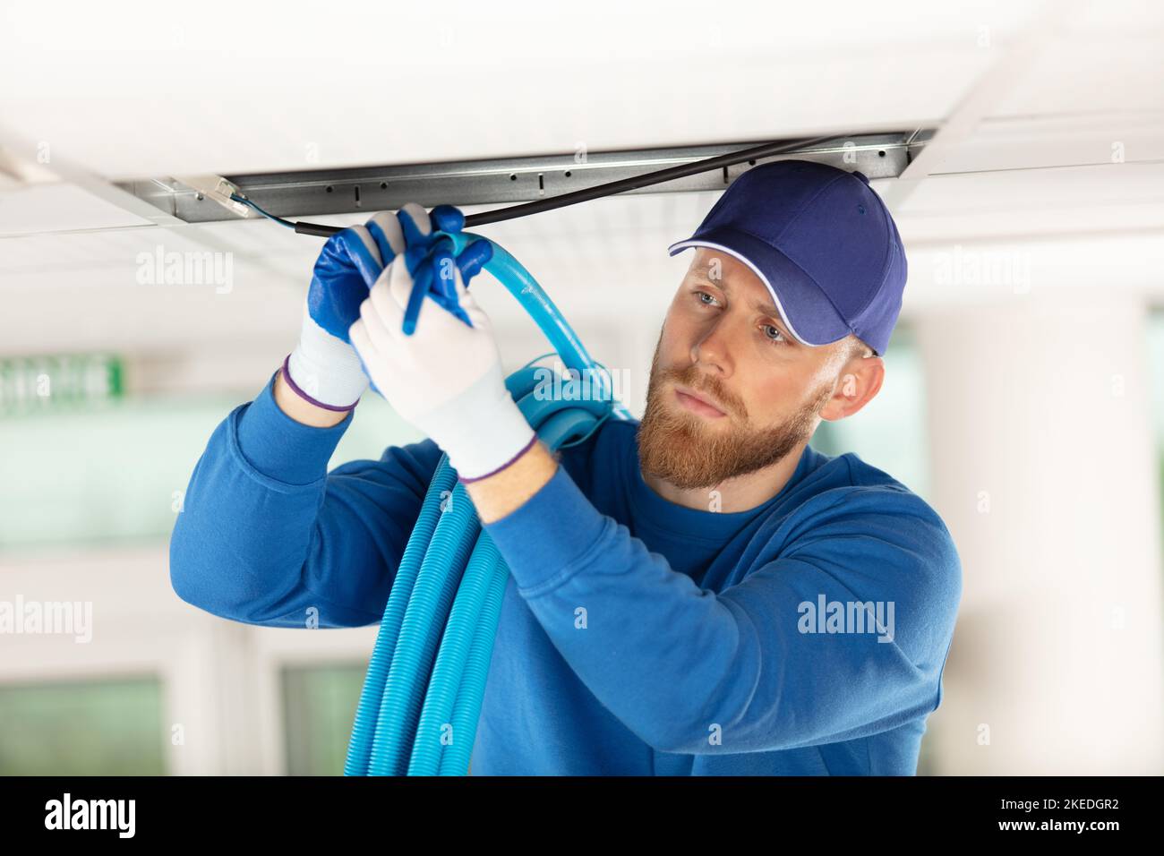 specialist repairs a ventilation system Stock Photo - Alamy