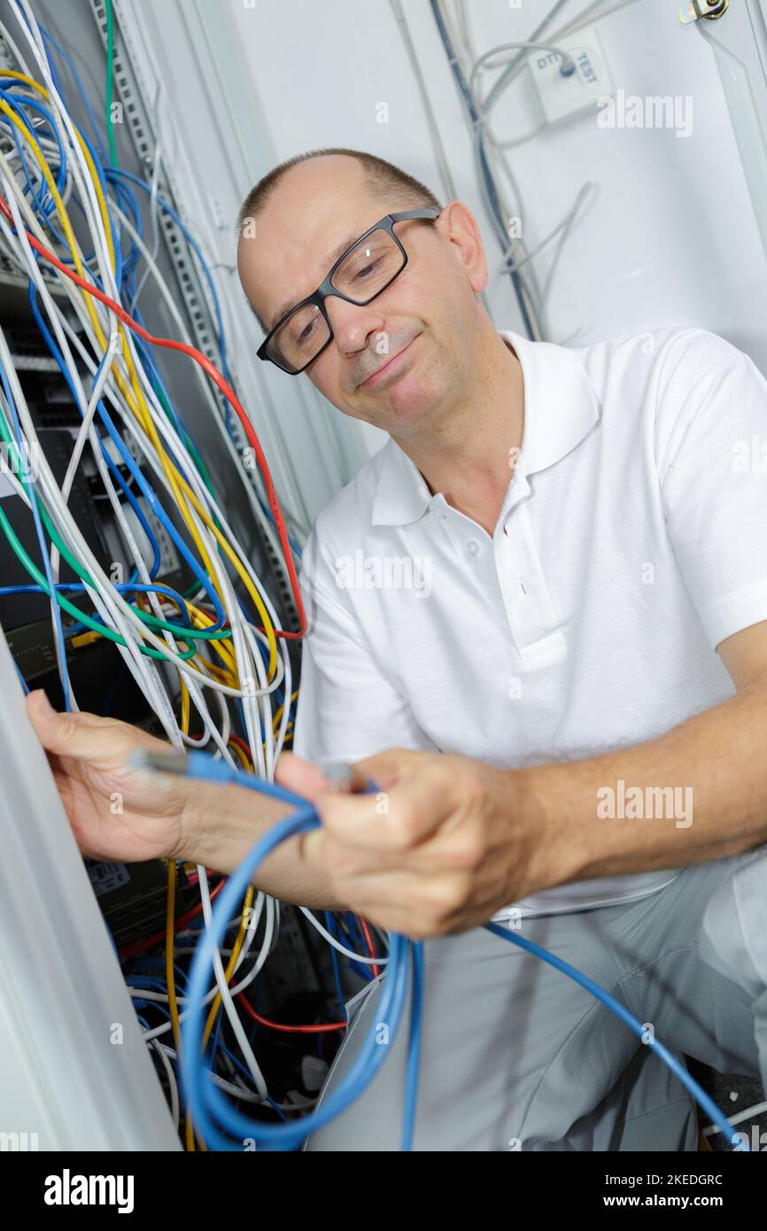 man in network server room Stock Photo - Alamy