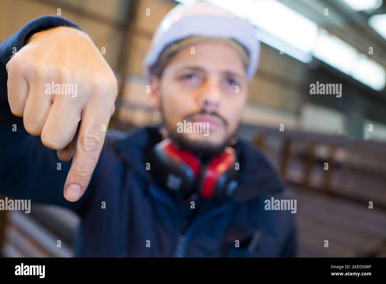 man with his finger down Stock Photo - Alamy