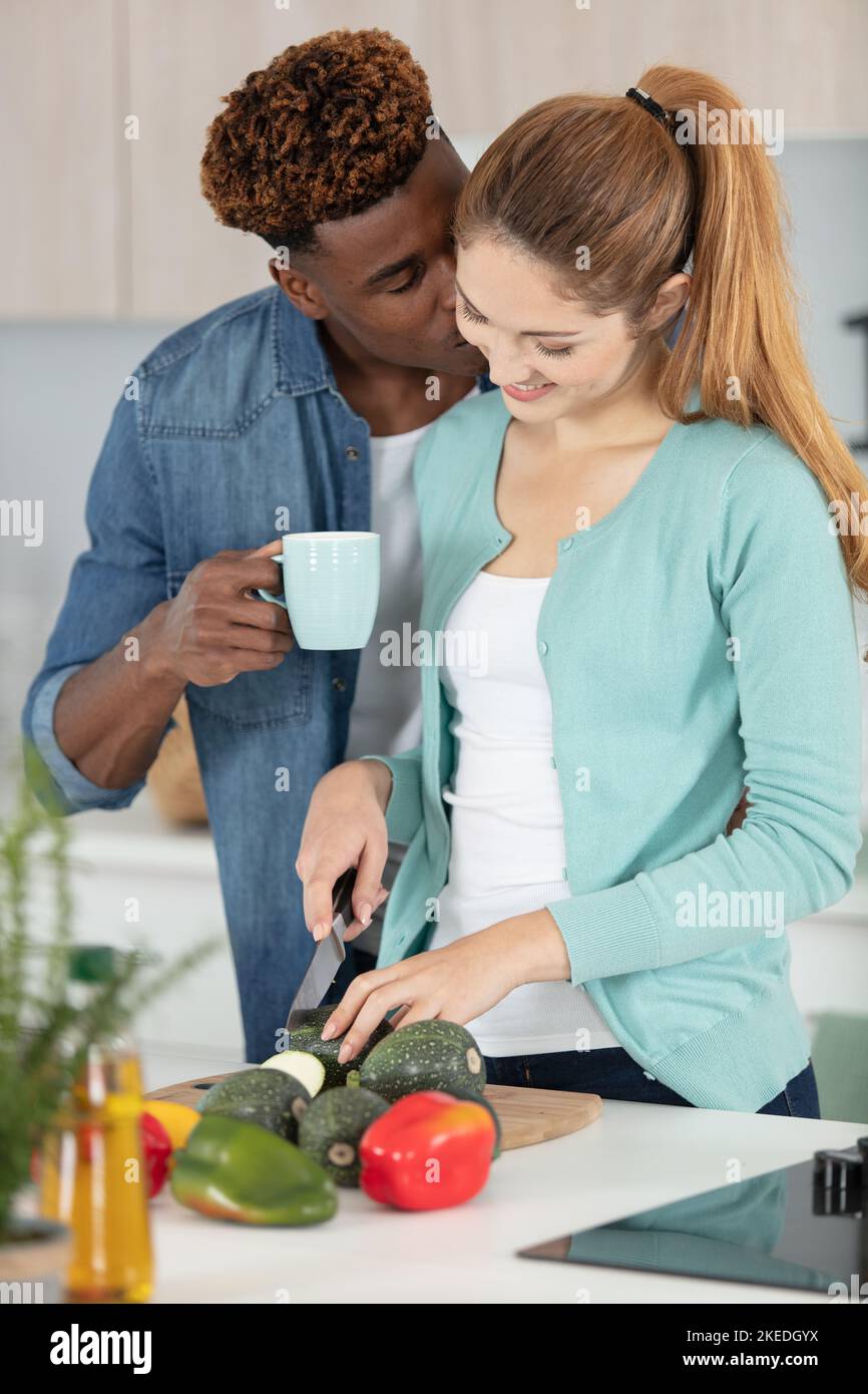 mixed race couple prepare a meal Stock Photo - Alamy