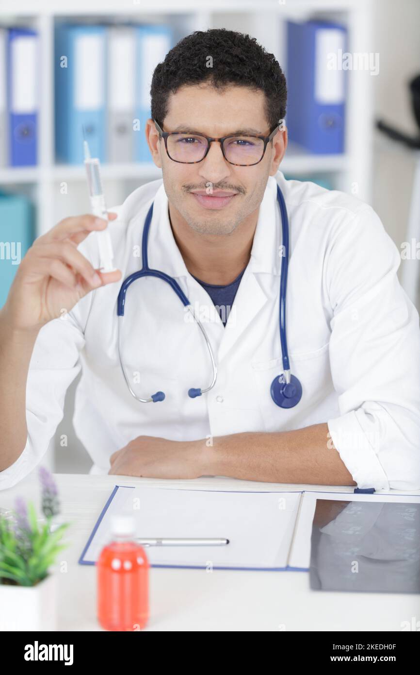 doctor with an injection needle Stock Photo - Alamy