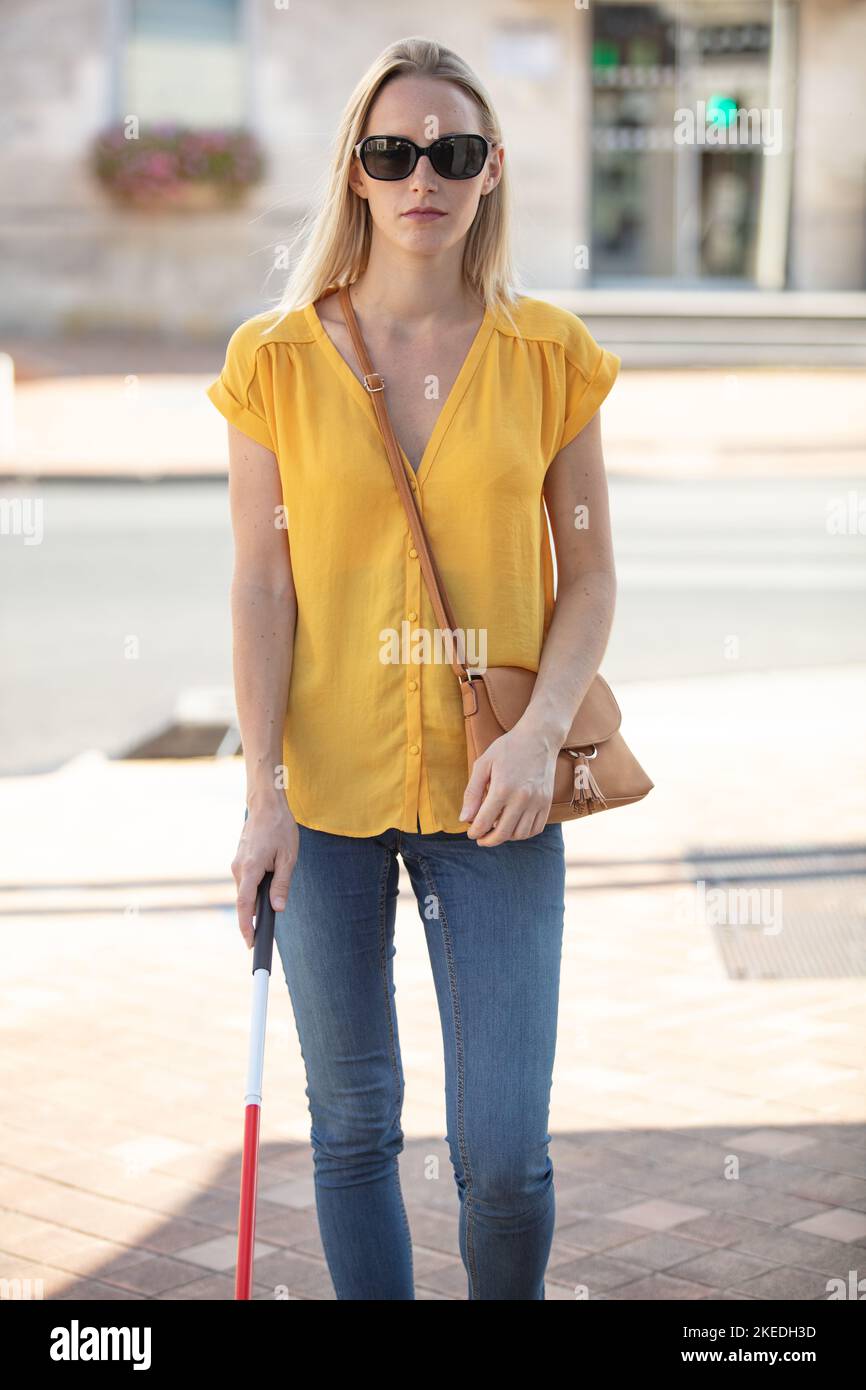 young blind woman crossing road Stock Photo - Alamy