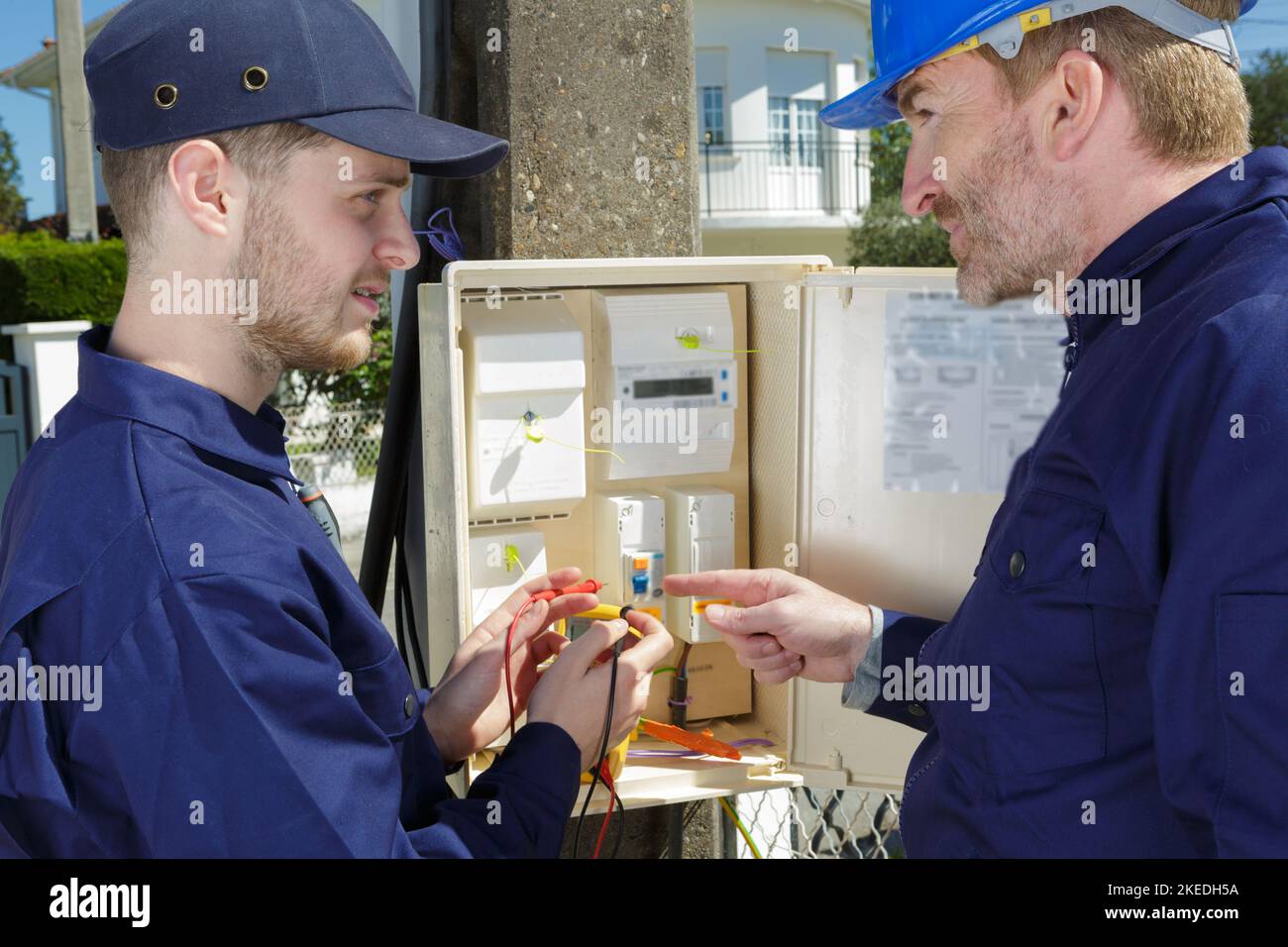 electrical technicians testing meter in cabinet Stock Photo - Alamy
