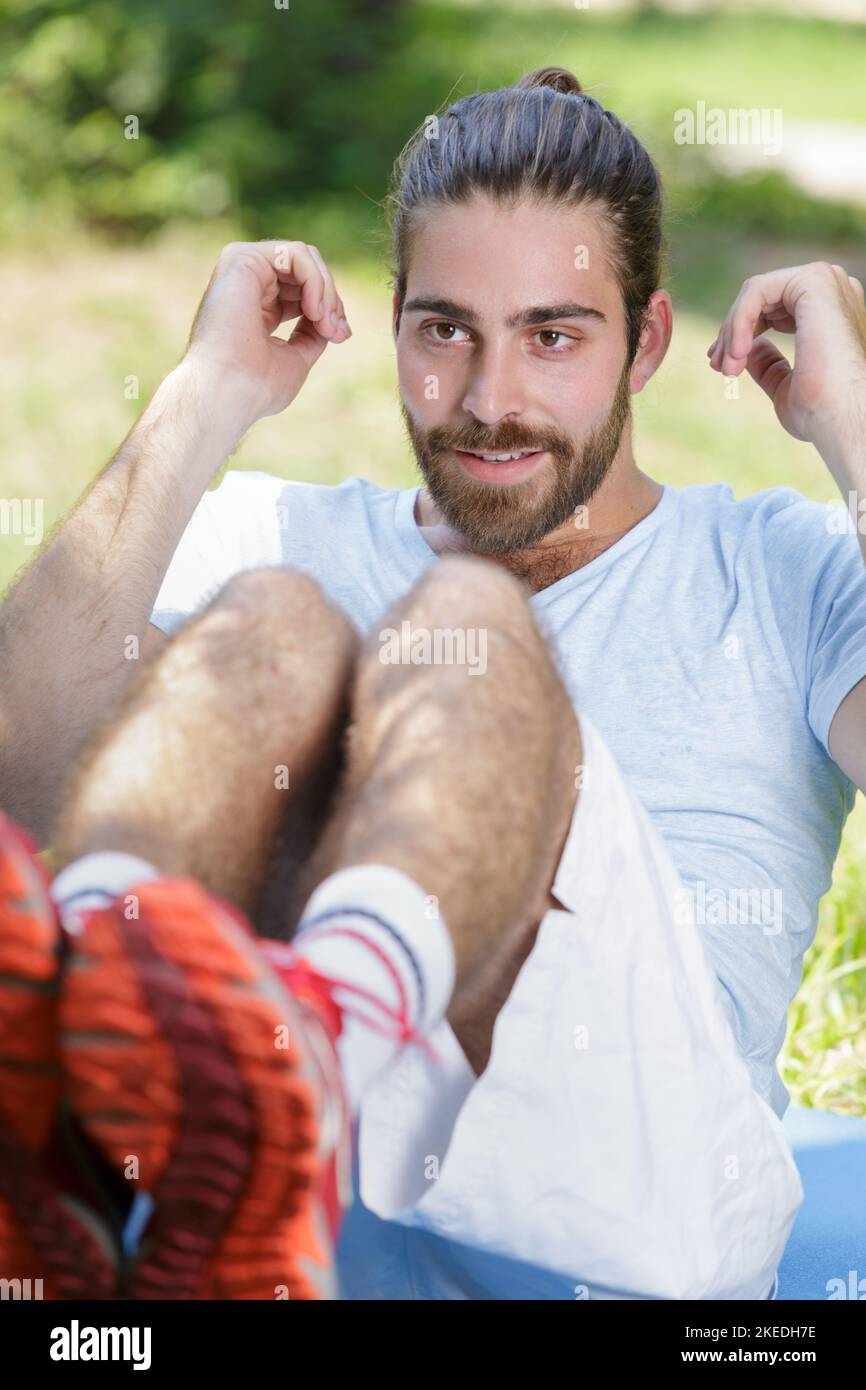 Man crunch legs hi-res stock photography and images - Alamy