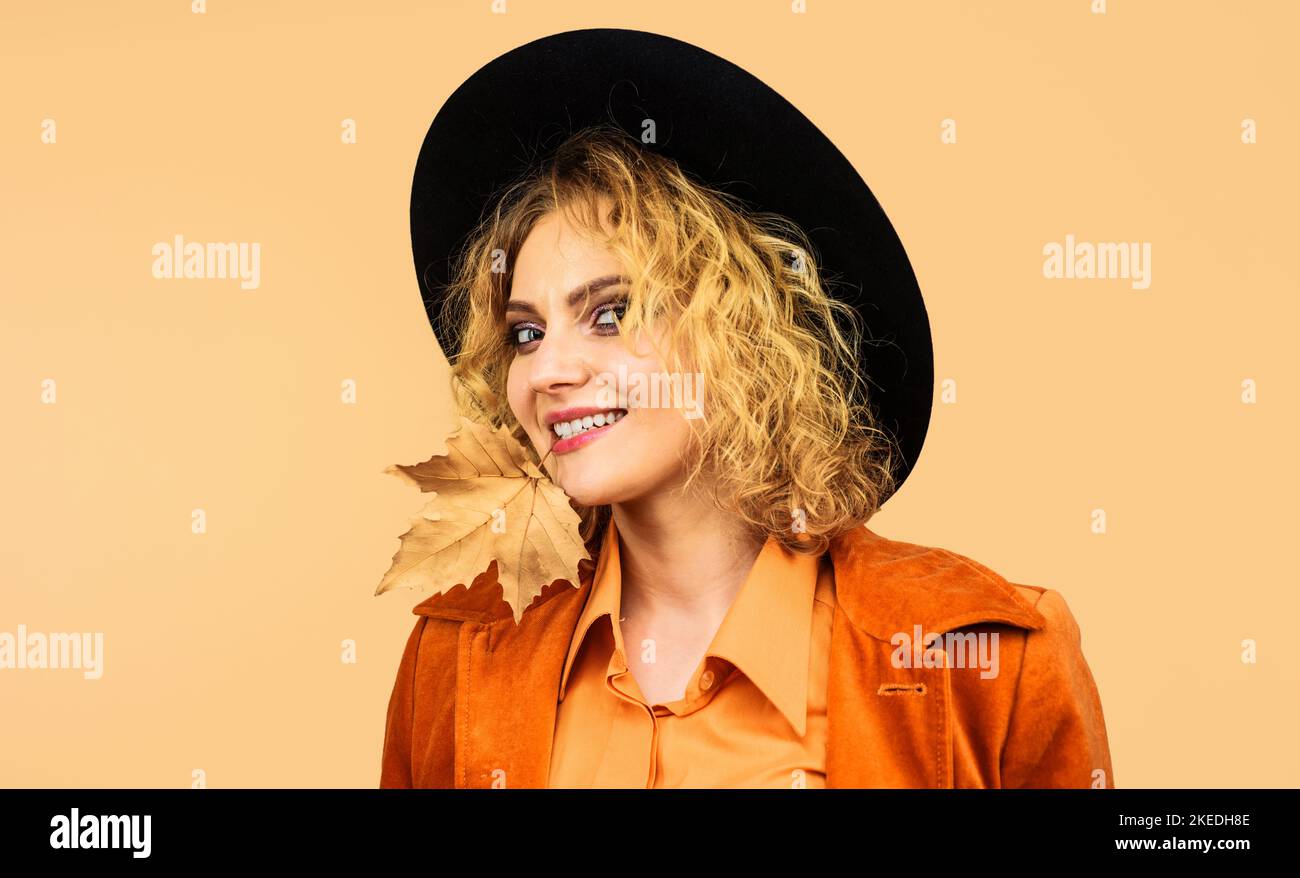 Beautiful girl in black hat with autumn leaf. Autumn sale. Autumn ...