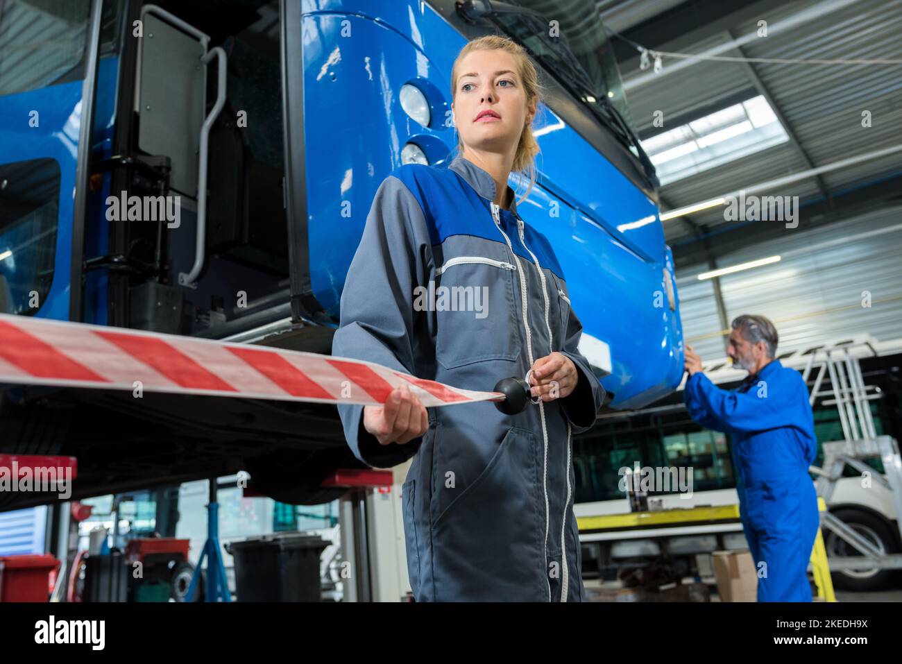 female garage worker with heavy equipment Stock Photo - Alamy