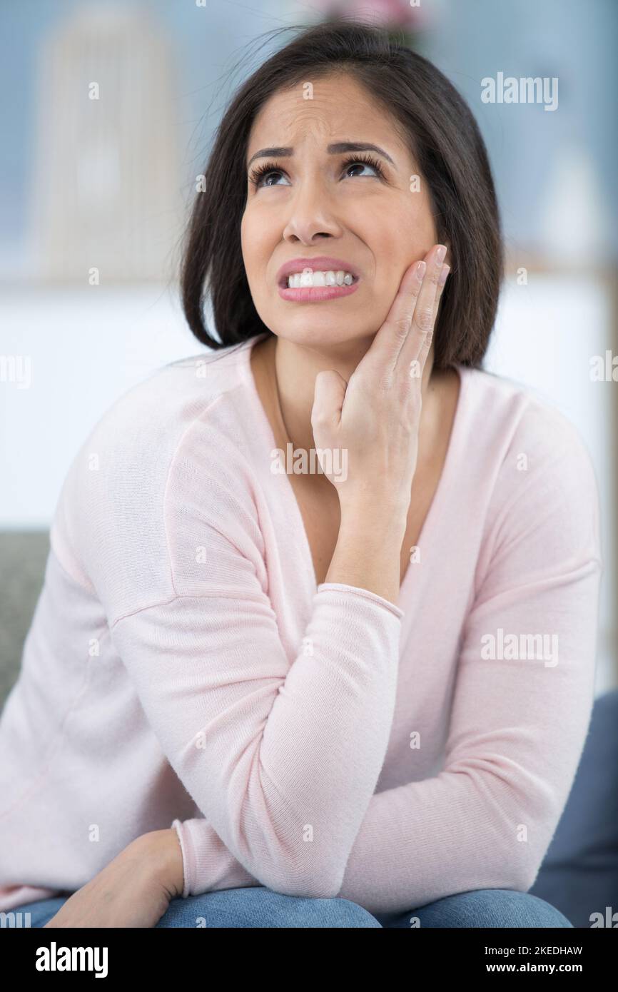 beautiful young woman suffering from terrible strong teeth pain Stock ...