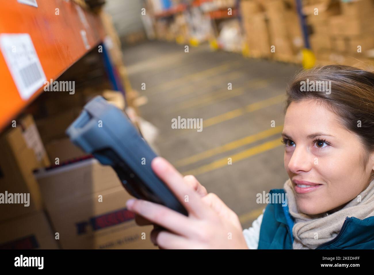 warehouse management system worker with barcode scanner Stock Photo - Alamy