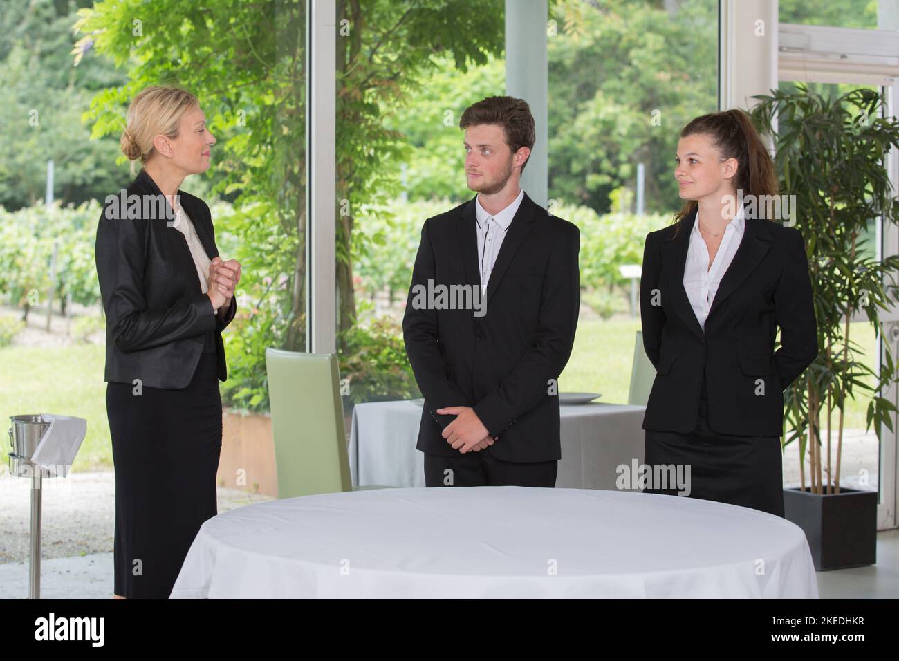 young waiter and waitress learning at service in restaurant Stock Photo ...