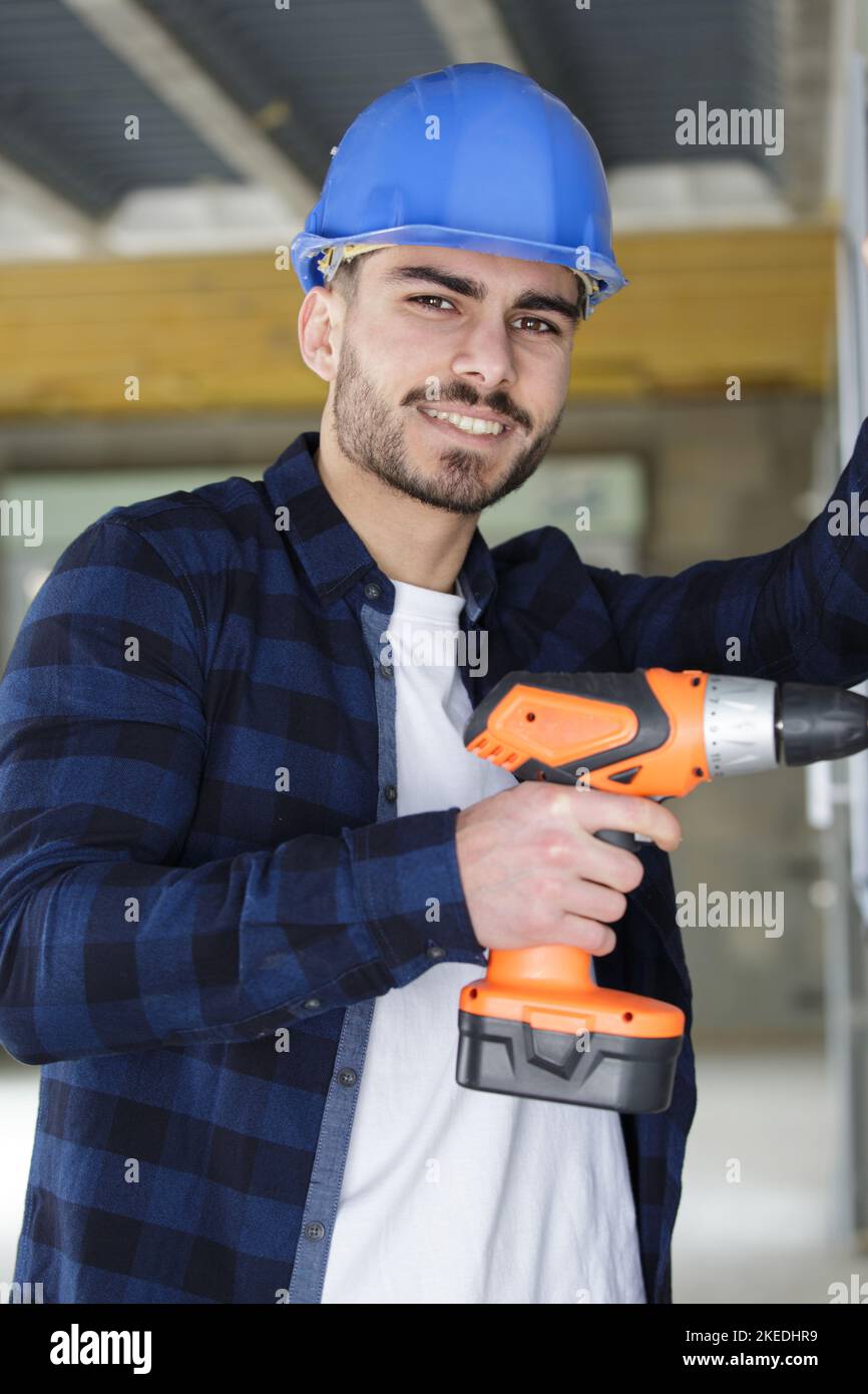 Back view man drilling hi-res stock photography and images - Alamy